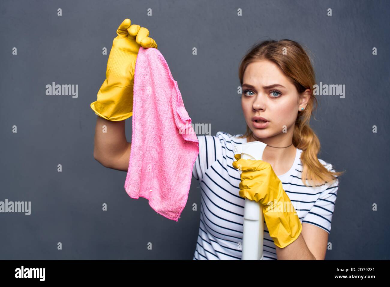 cleaning lady with pink rag in hand home care service gray background ...