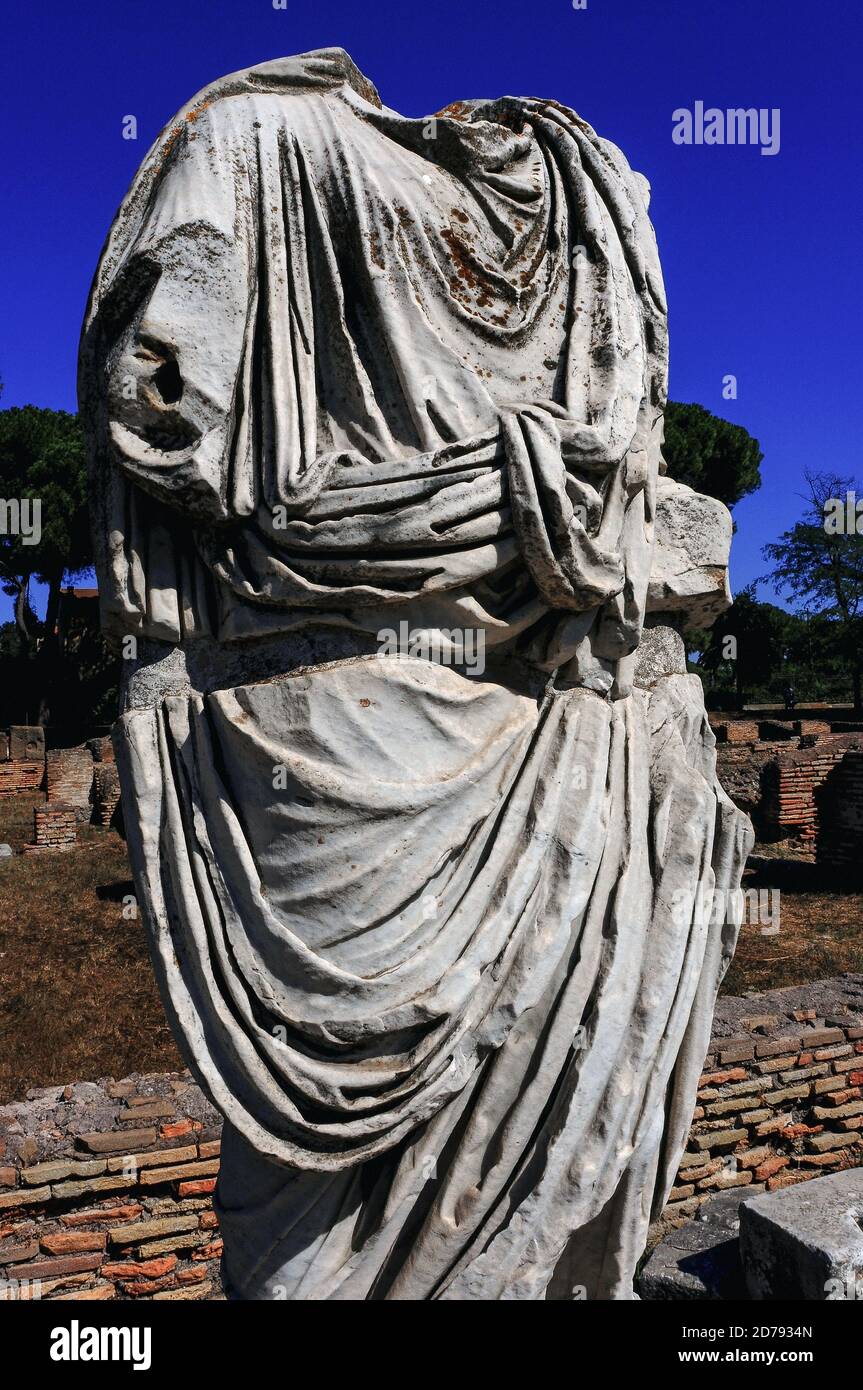 Headless male statue in the Porta Romana necropolis at Ostia Antica ...