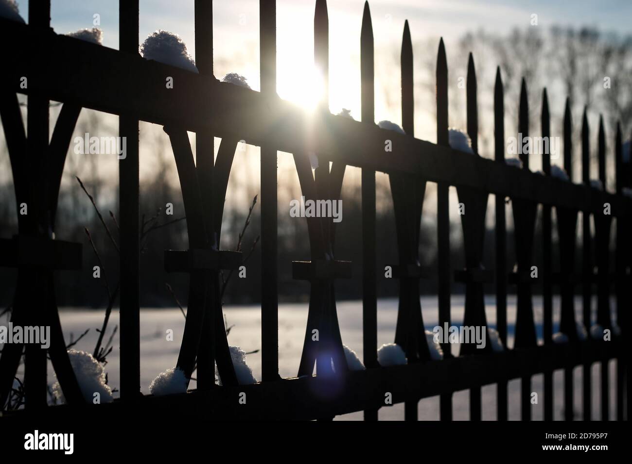 fence with spikes sun Stock Photo - Alamy