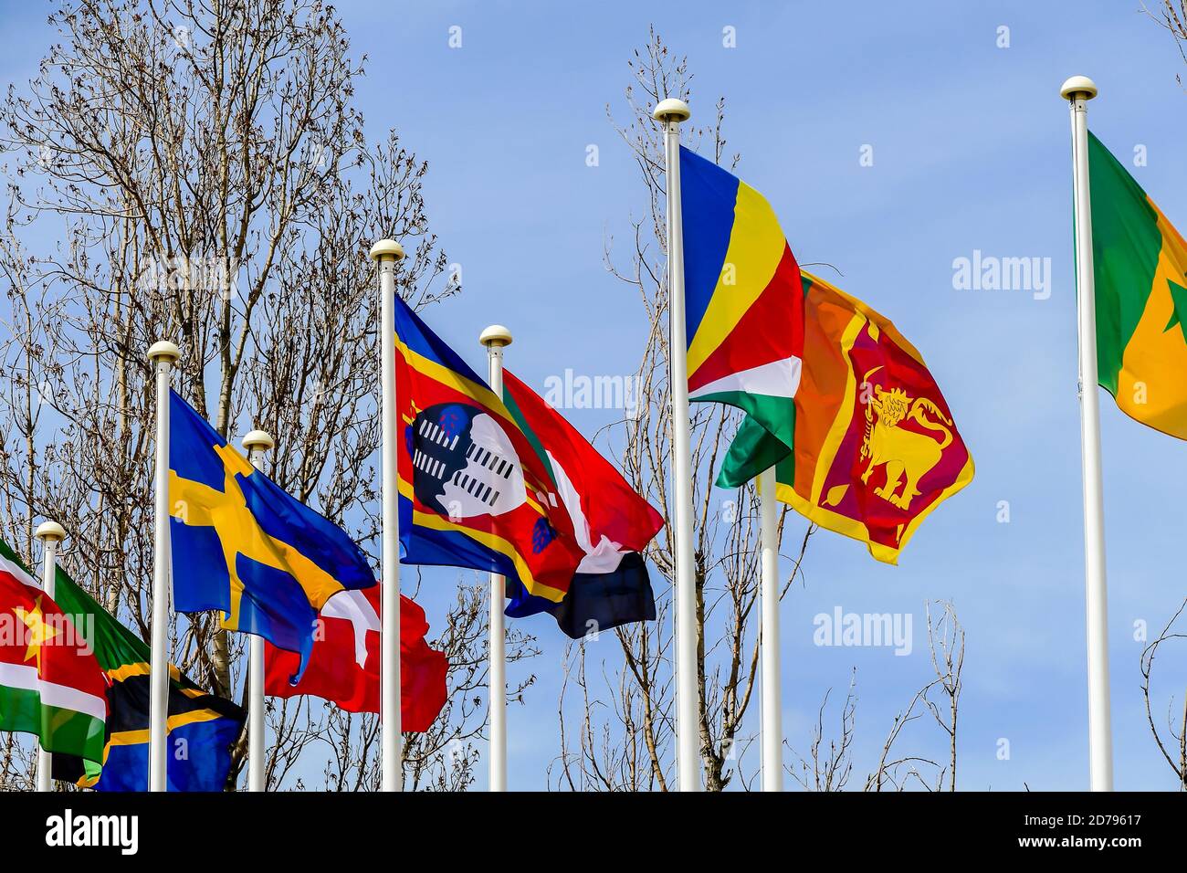 flags of different countries on background of blue sky, in Lisbon ...