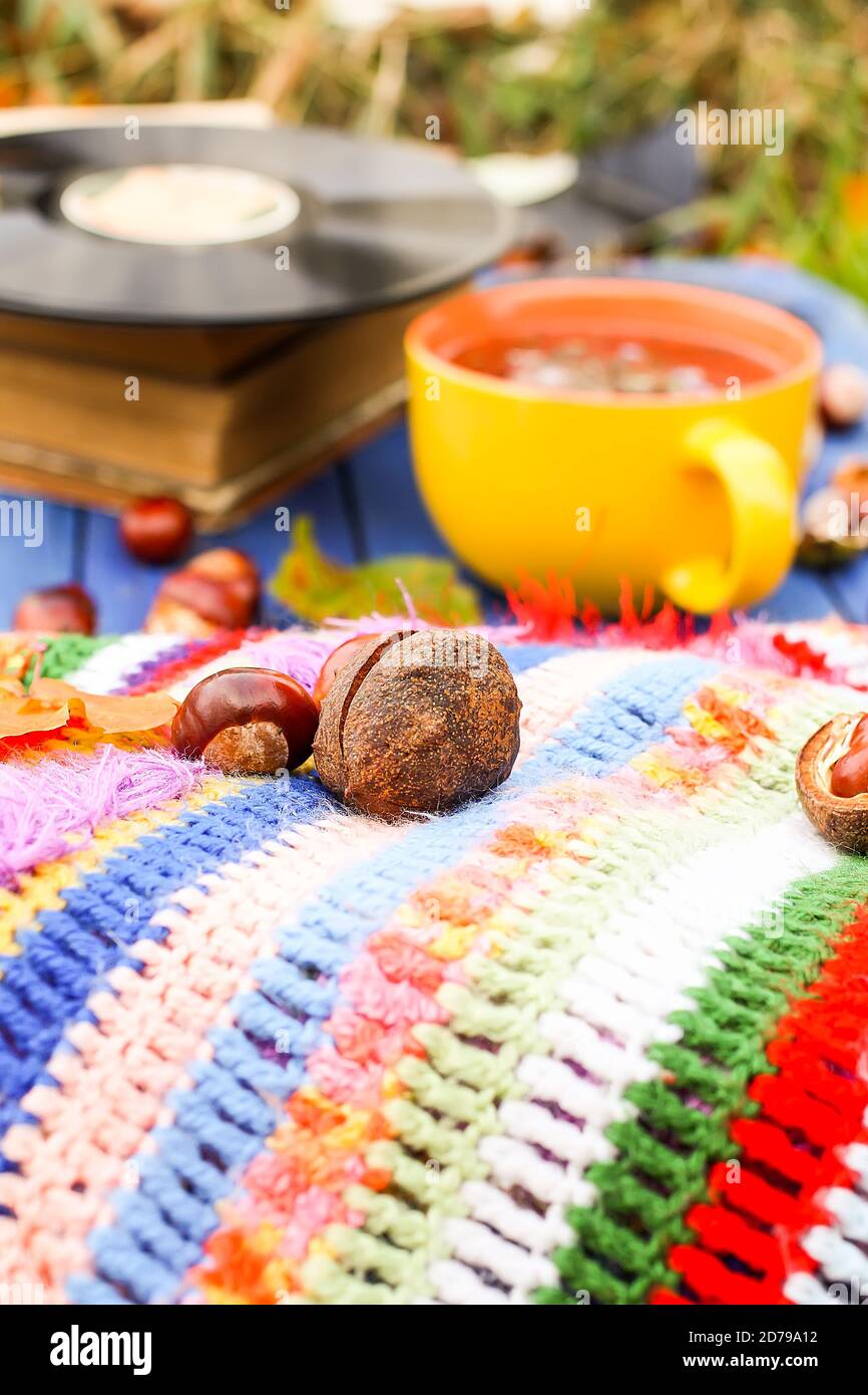 Autumn composition of yellow ceramic cup of herbal tea and vintage ...