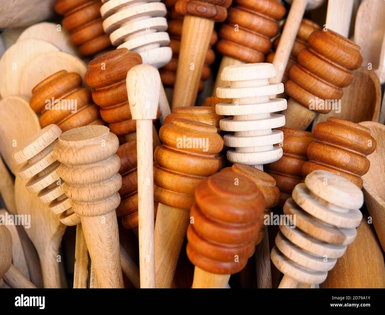 Group of honey spoons on sale in a street market Stock Photo - Alamy