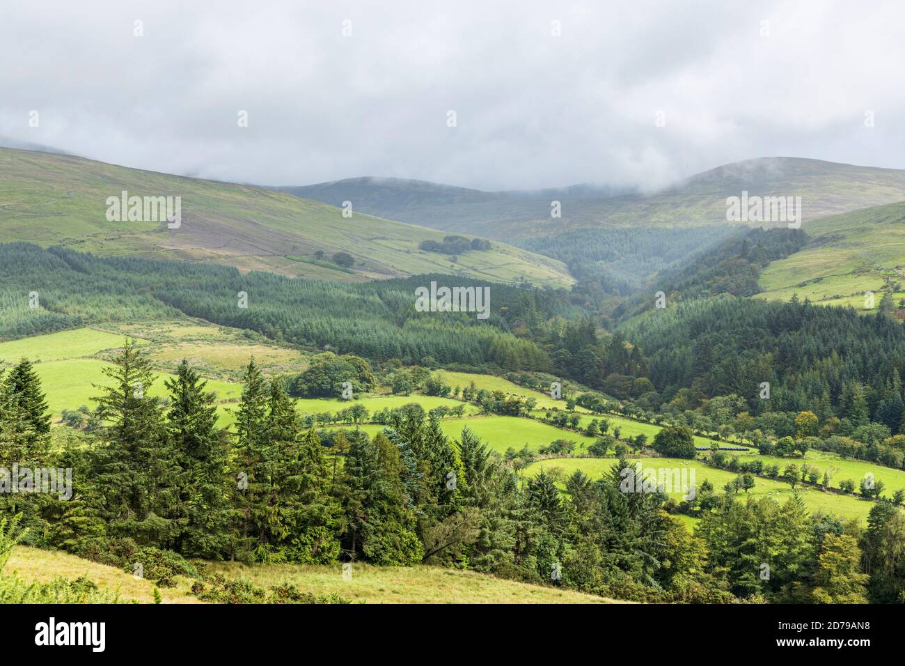 Rainclouds sweep in to the valley in the Galtee mountains, County ...