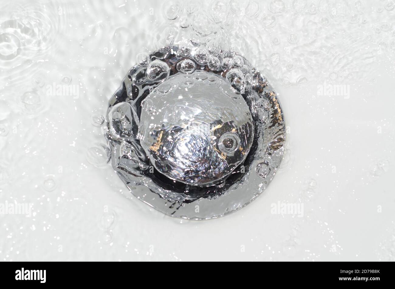 Sink with Plug Hole and Water Stock Photo - Alamy