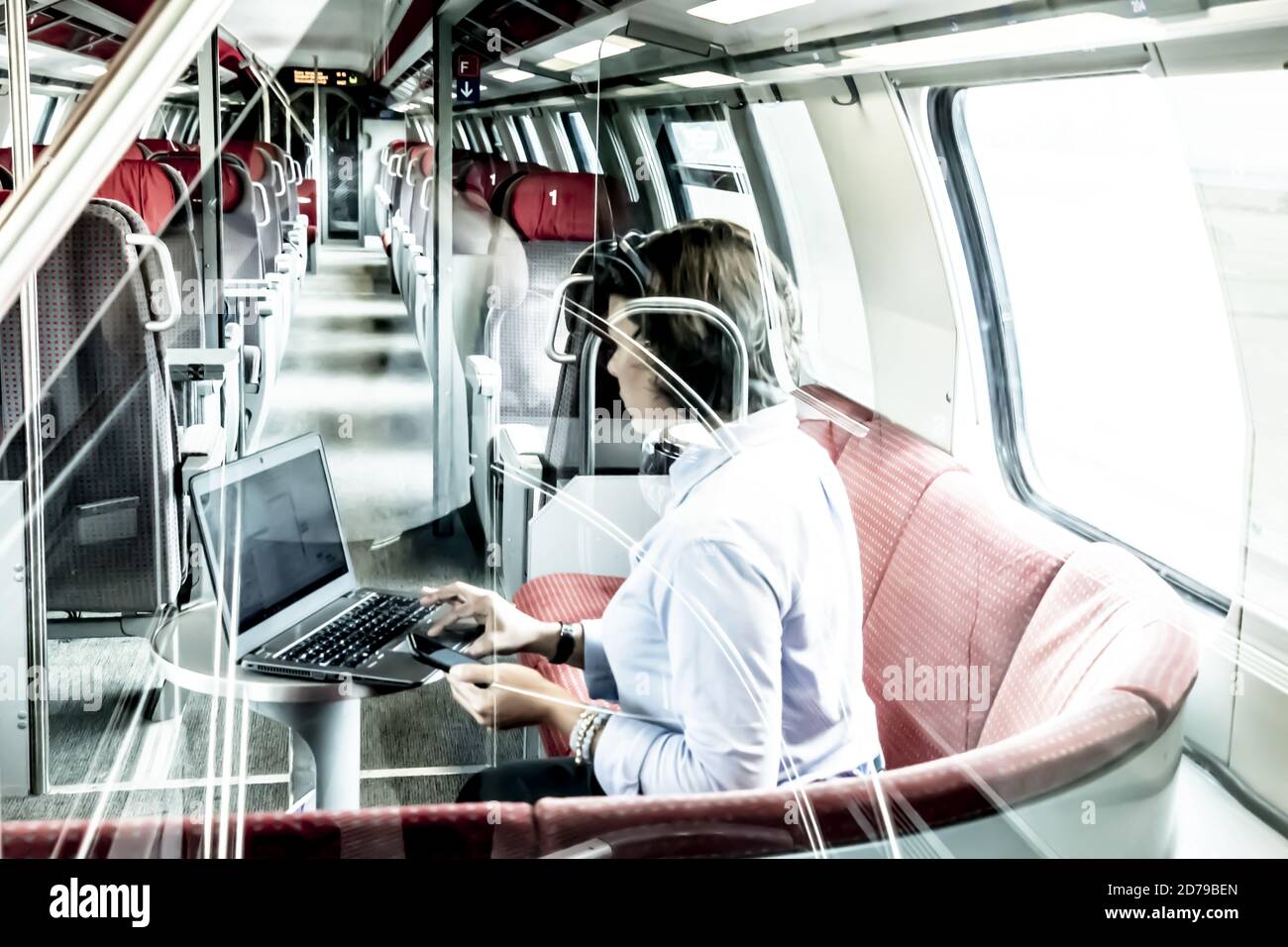 Woman Working on Laptop in First Class in a Train in Switzerland Stock ...