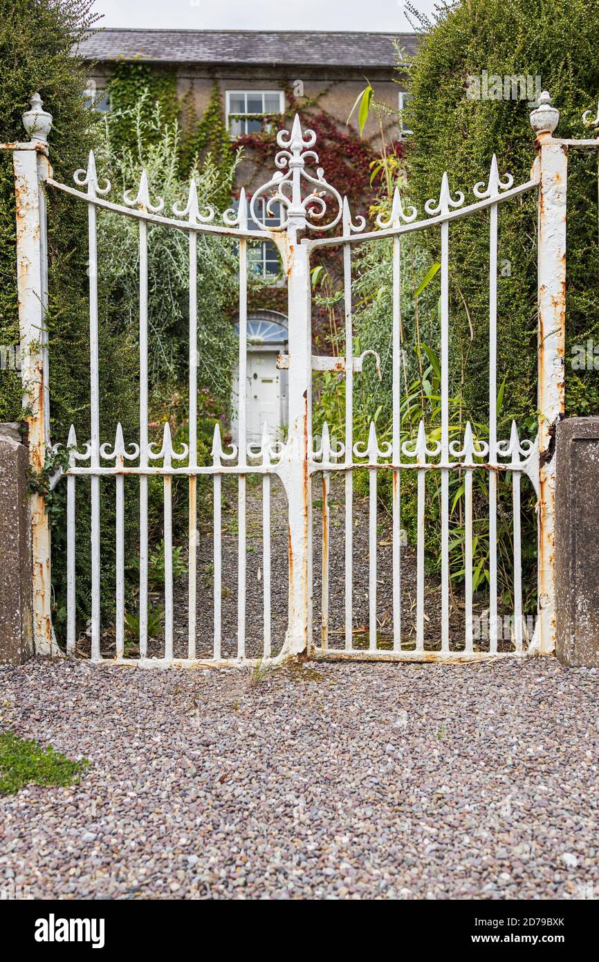 White wrought iron gates to the front garden of a house in Kinsale ...