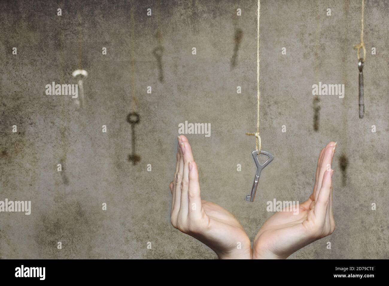 hand stretching for one of the many old vintage keys Stock Photo - Alamy