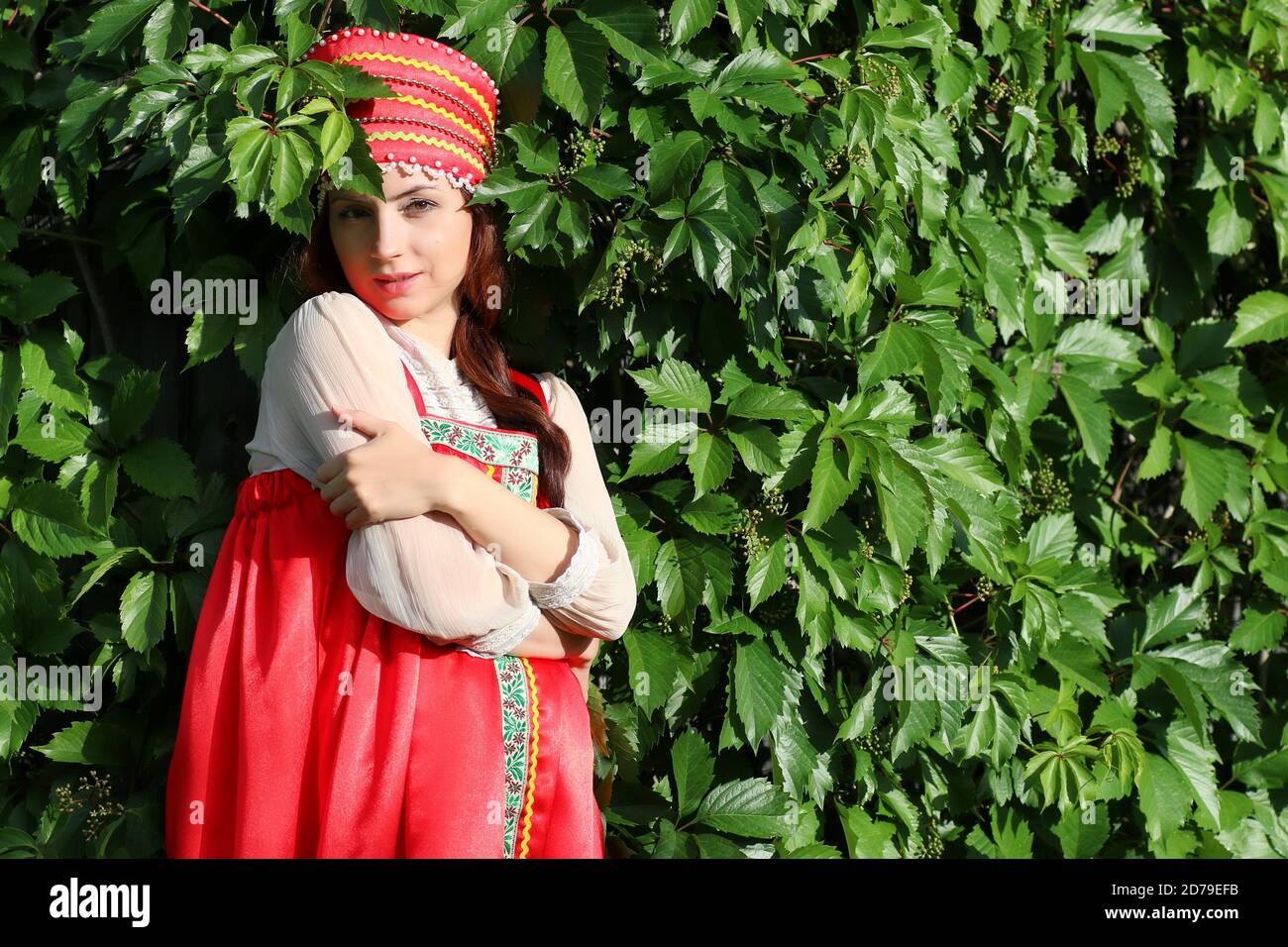 Slav in traditional dress ivy wall tree Stock Photo - Alamy