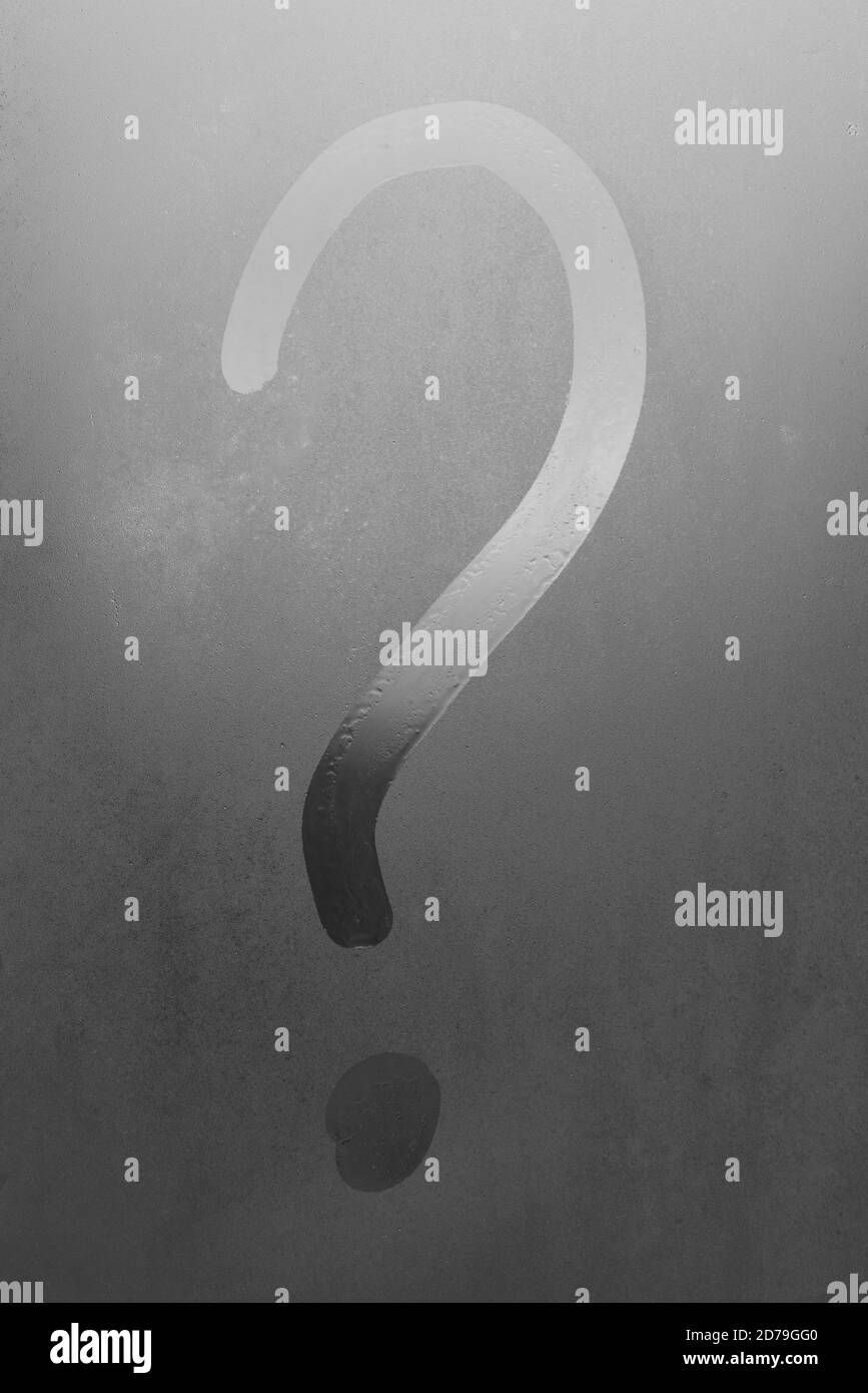 Inscription question mark on the sweaty glass. question mark drawn on a ...