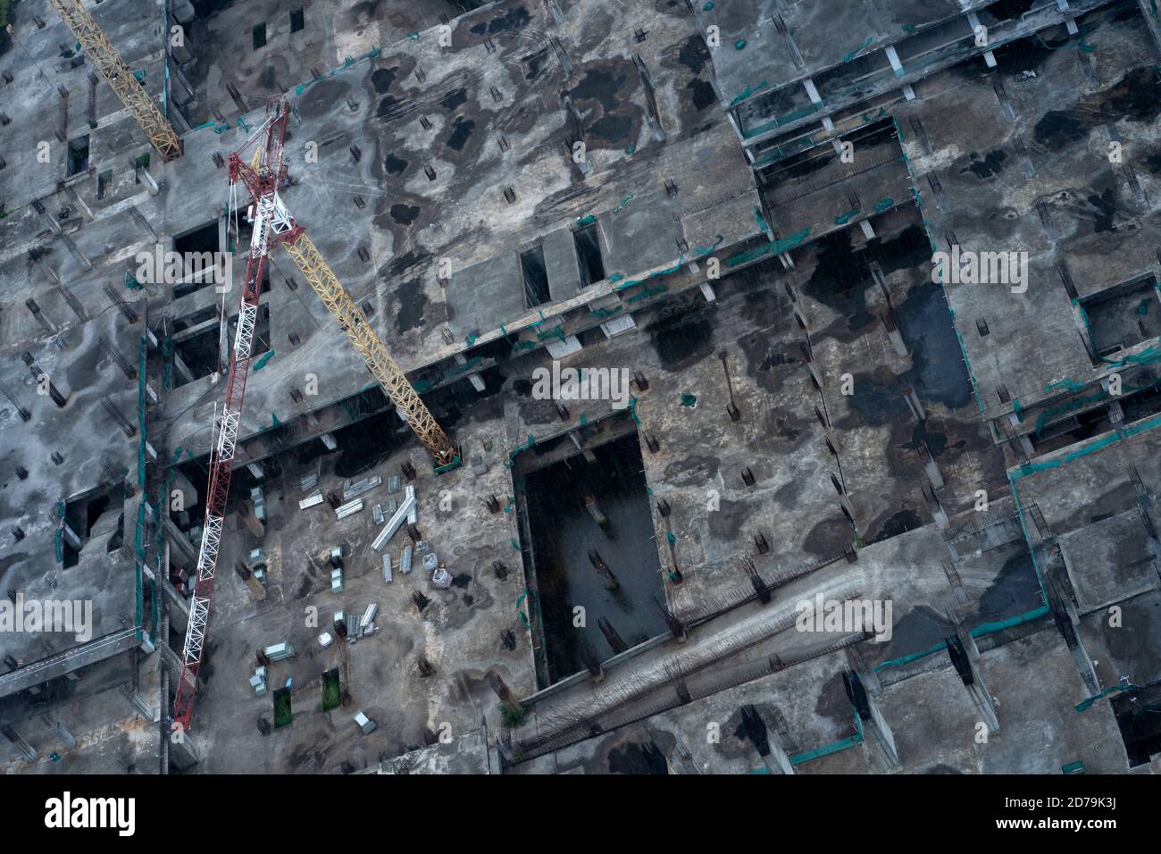 Top view of the construction site of a large building after rain. Piles ...