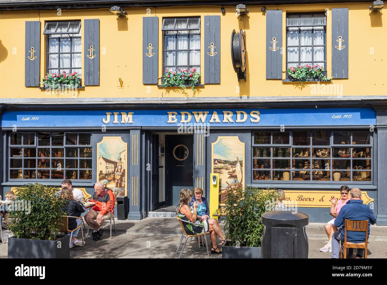 Customers sitting outside Jim Edwards pub in the sunshine, Kinsale ...