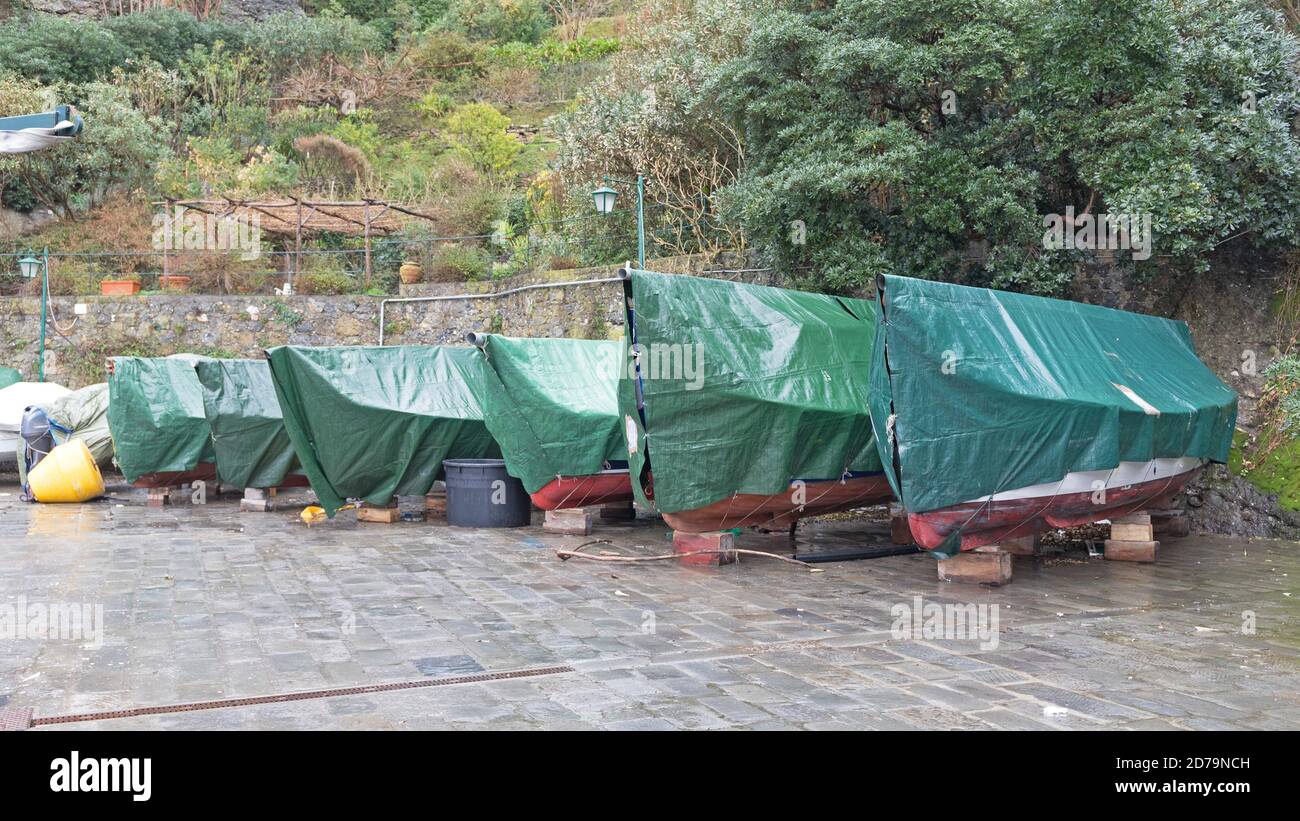 Boats Covered With Tarp Packed For Winter Safety Stock Photo - Alamy