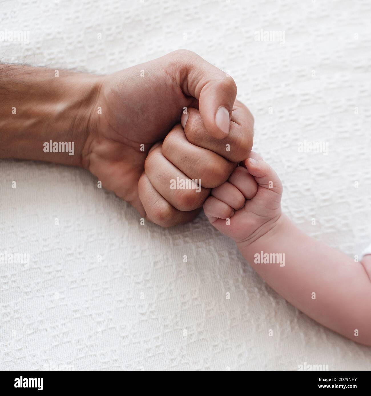 baby's hand with father's hand. little infant's hand. baby with dad ...