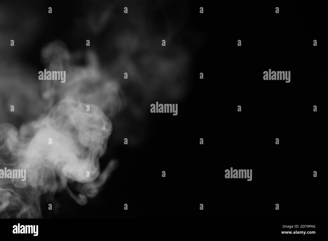 White smoke on a black background. Texture of smoke. Clubs of white ...