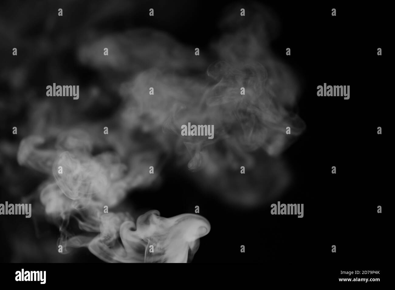 White smoke on a black background. Texture of smoke. Clubs of white ...