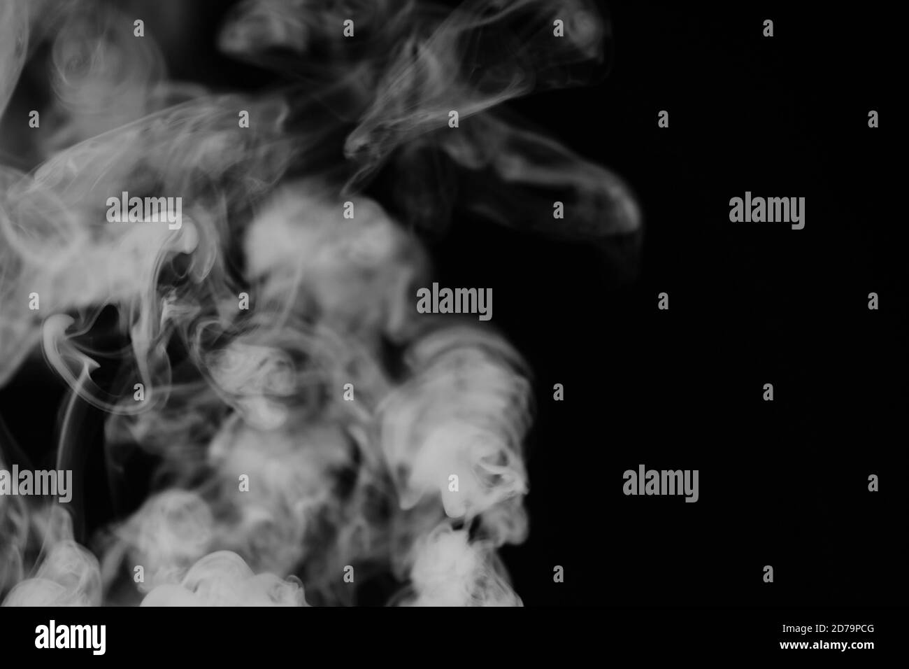 White smoke on a black background. Texture of smoke. Clubs of white ...