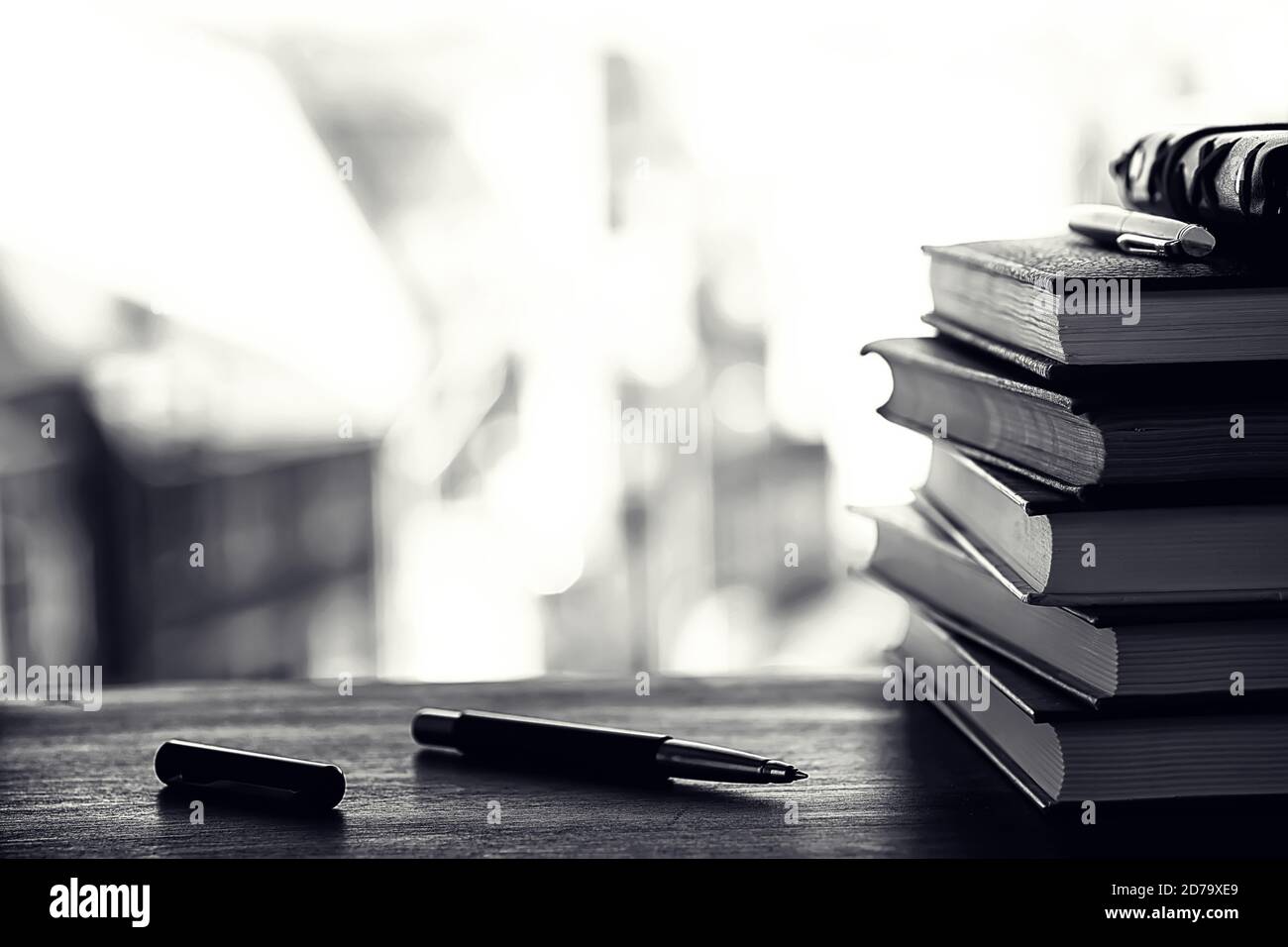 A stack of textbooks on a table Stock Photo - Alamy
