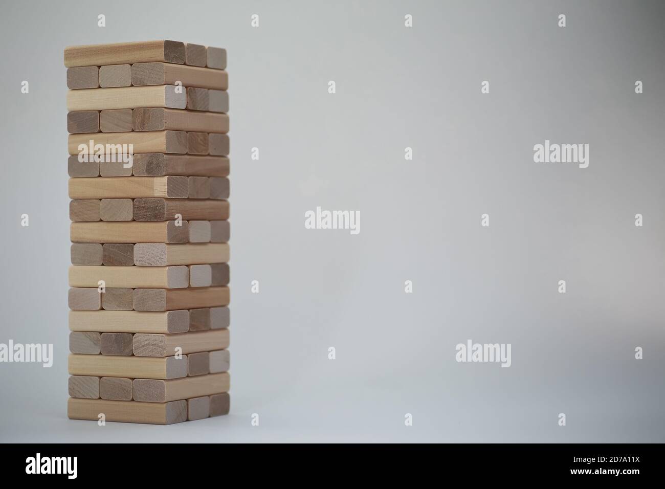 Board game jenga tower of wood sticks Stock Photo - Alamy