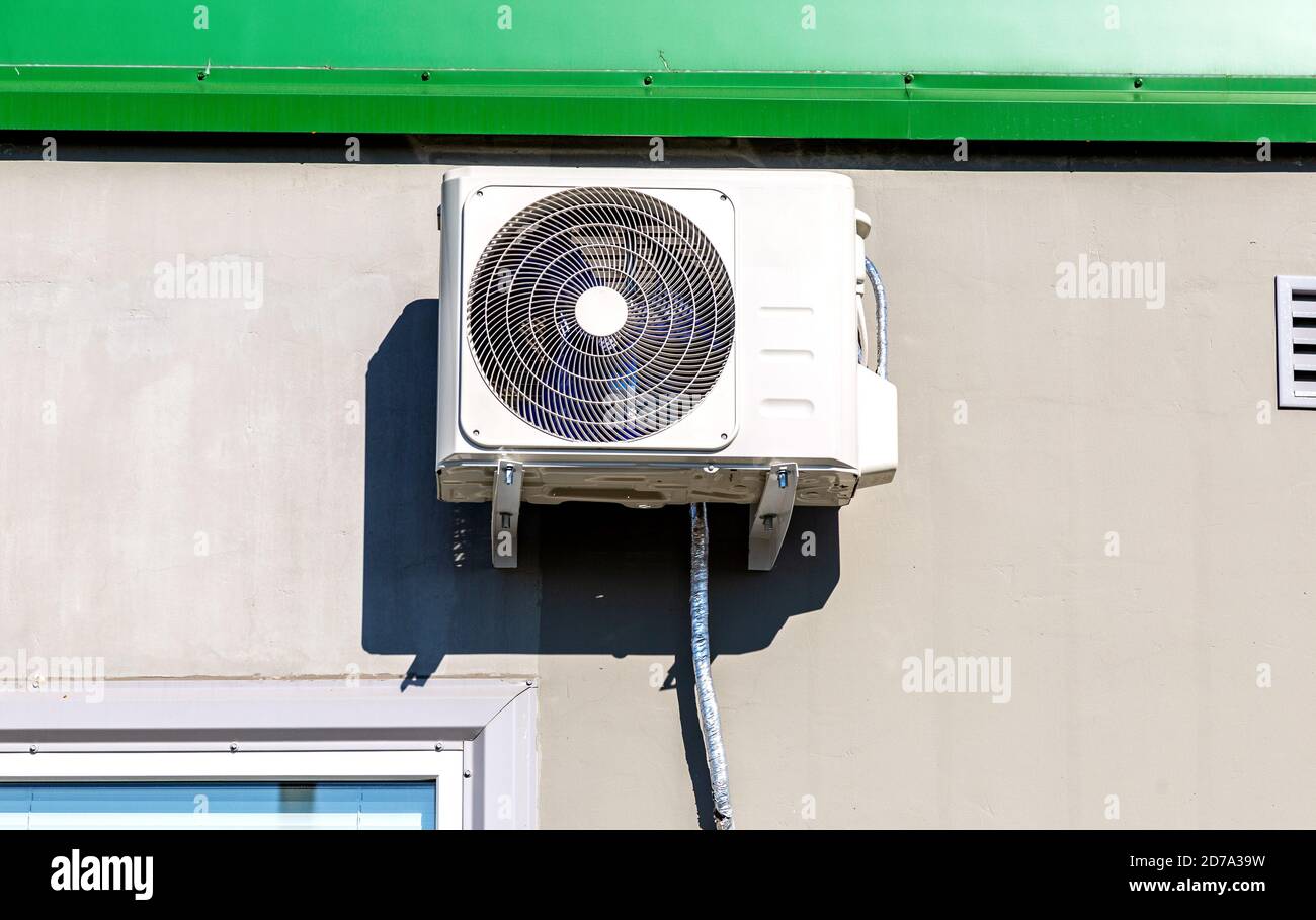 Air conditioner hang on the wall of a building Stock Photo - Alamy