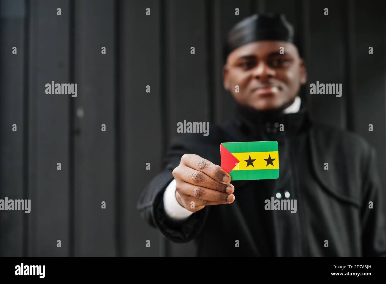African man wear black durag hold Sao Tome and Principe flag at hand ...