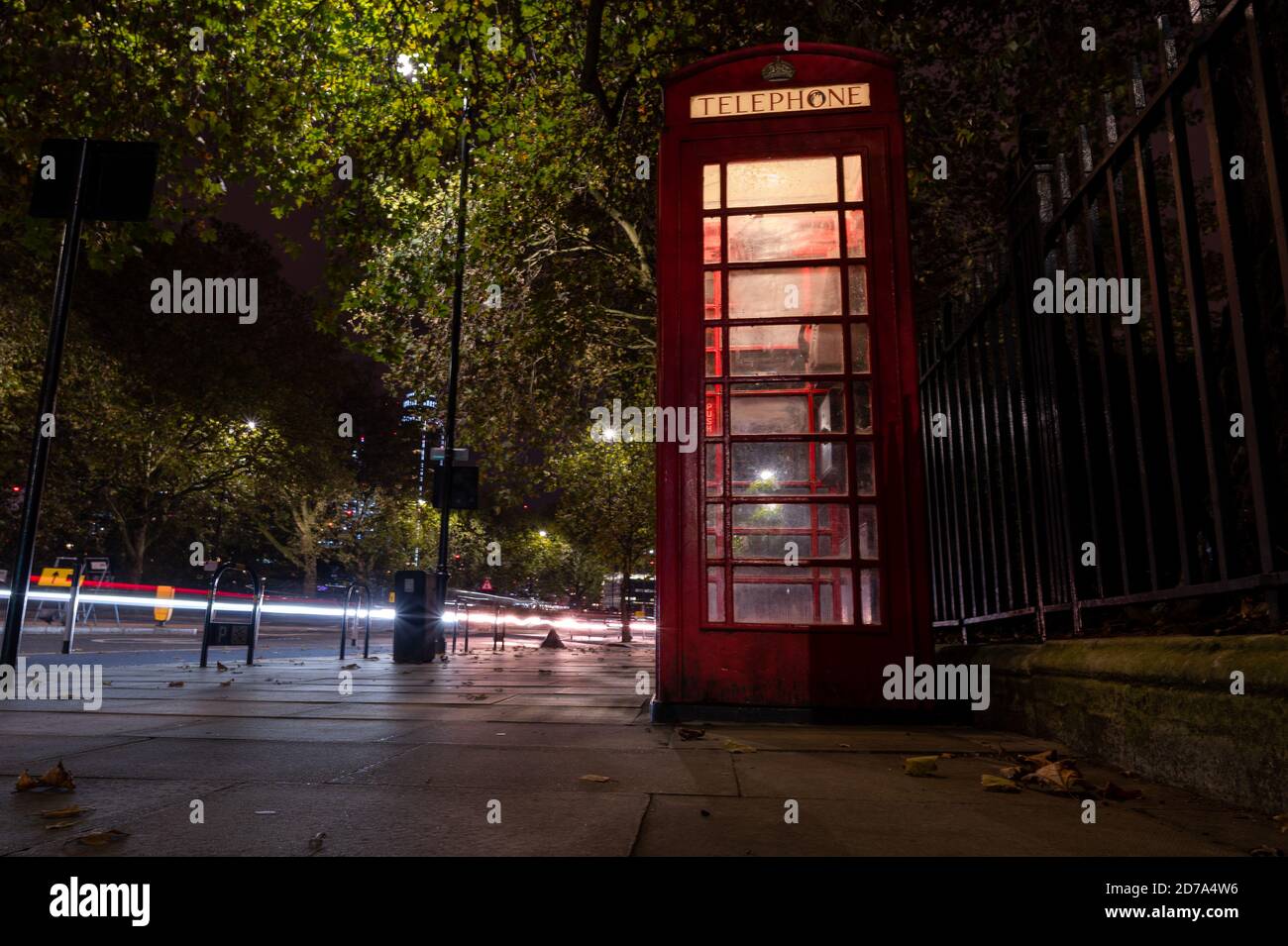London, UK - 18 Oct 2020: British red telephone box in London in front ...