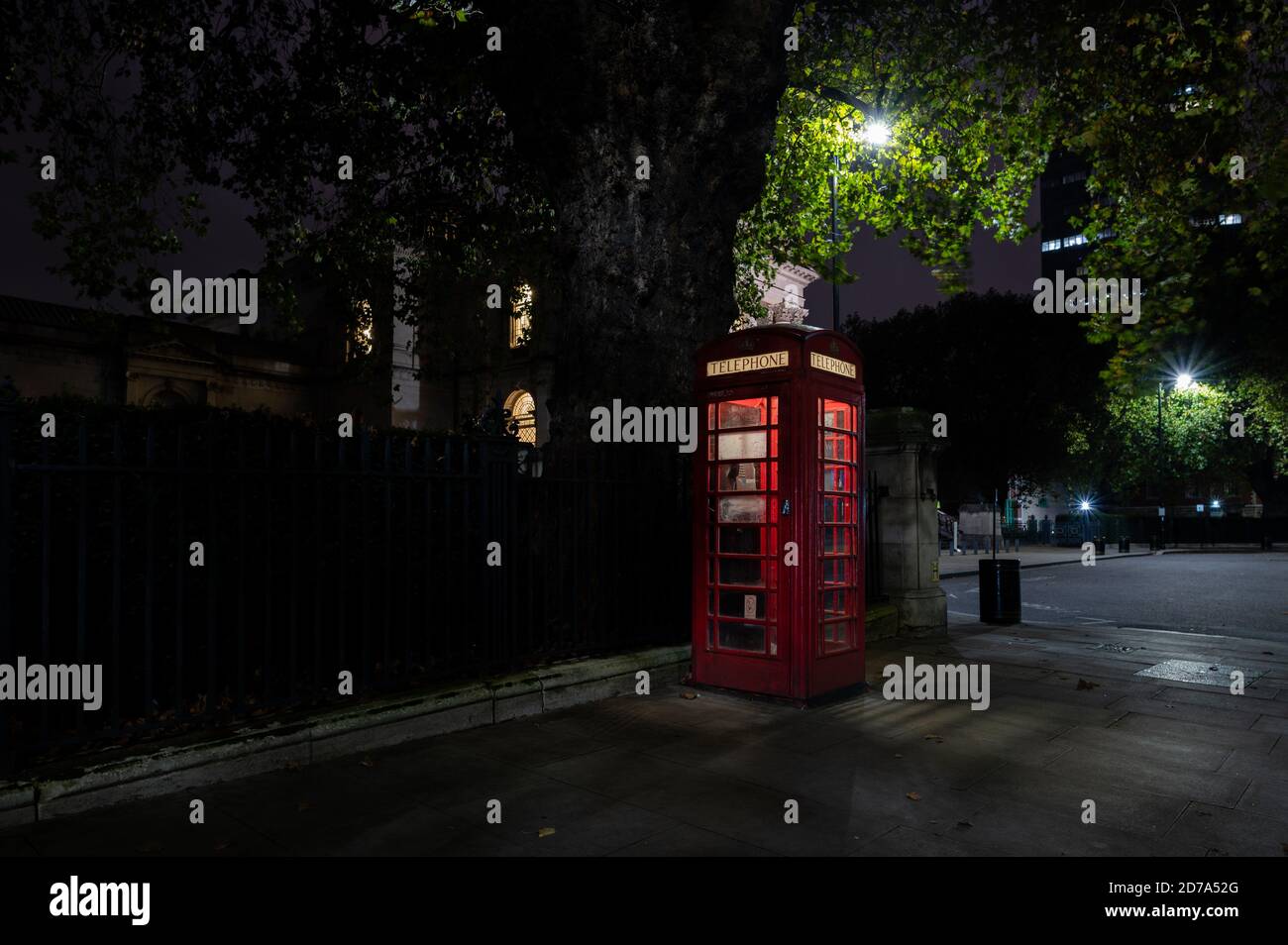 London, UK - 18 Oct 2020: British red telephone box in London in front ...