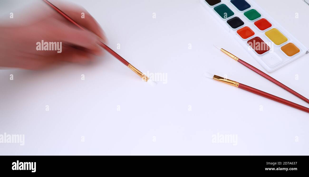 Drawing paints on a white sheet of paper Stock Photo - Alamy