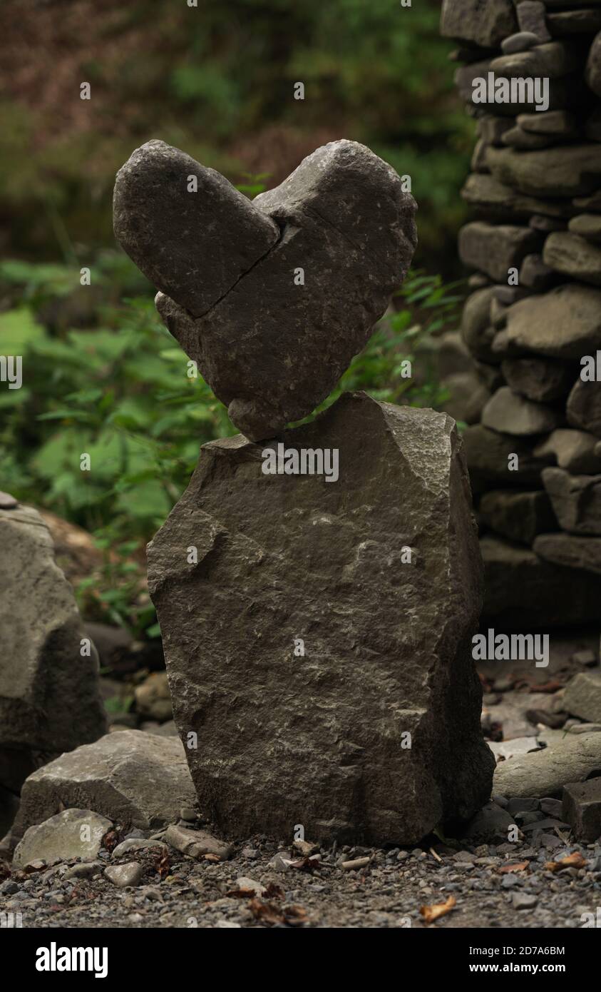 Perfect balanced broken Heart shape rocks outdoors Stock Photo - Alamy