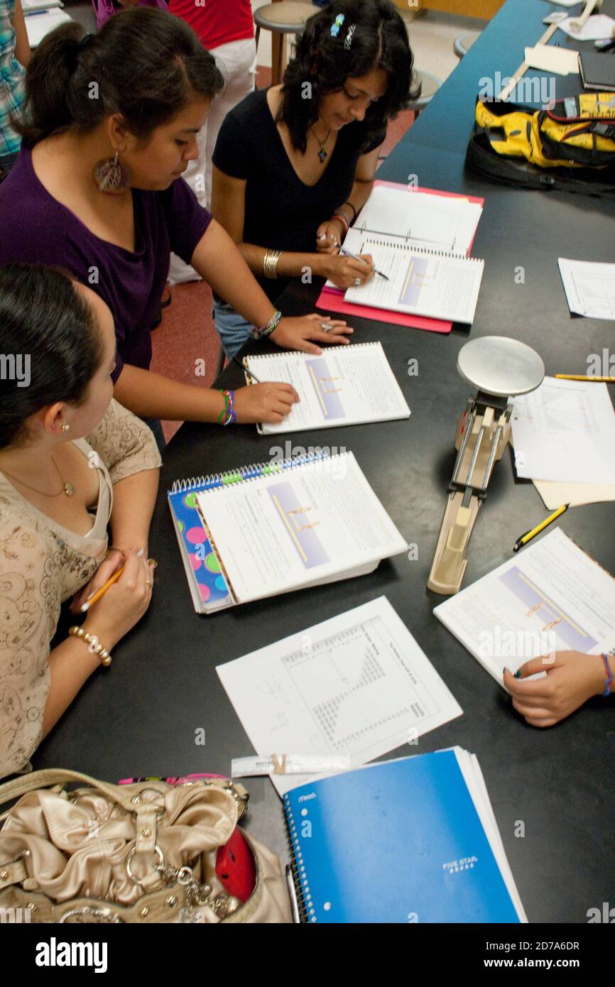 Students fill out worksheets during class at Achieve Early College High ...