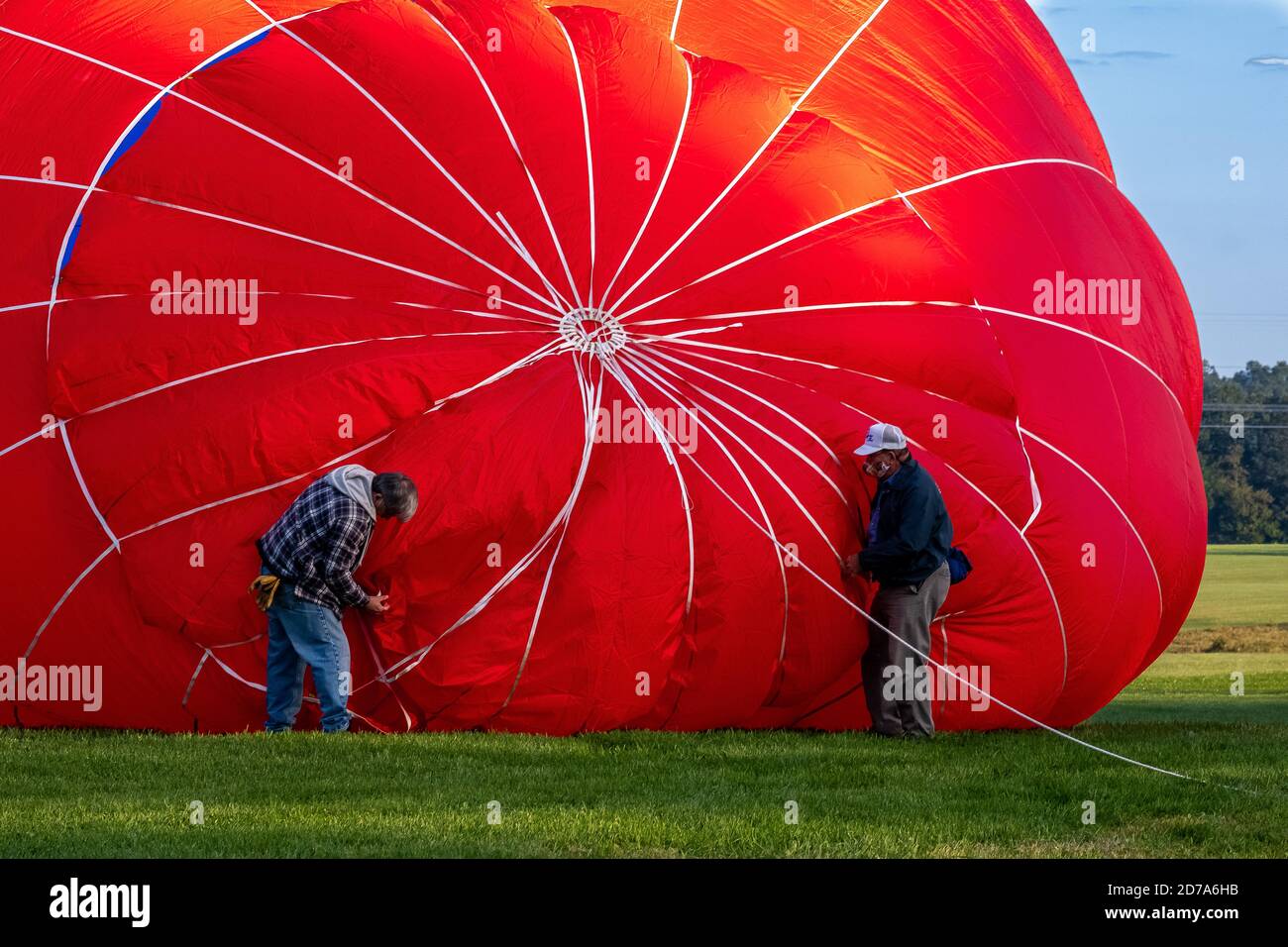 Inflating Red Hot Air Balloon Stock Photo - Alamy
