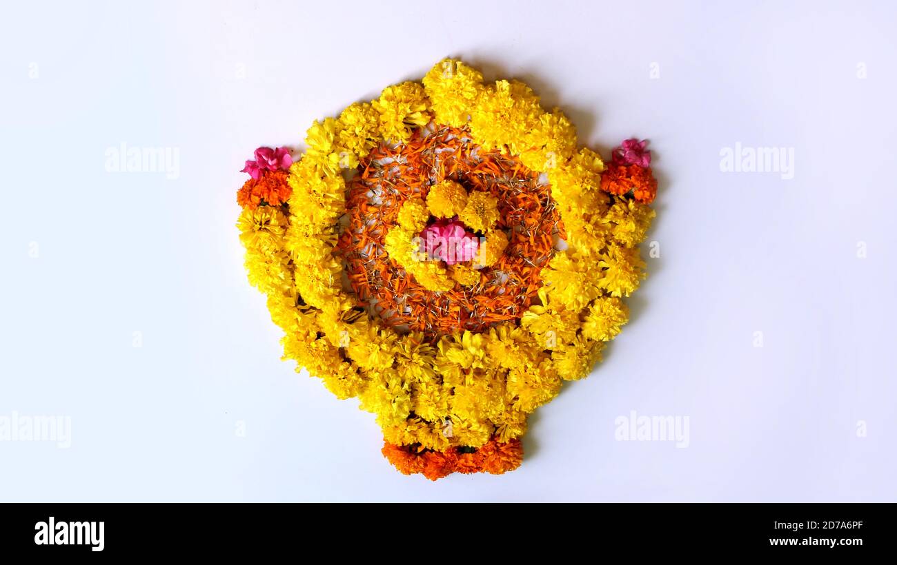 flower Rangoli for Diwali or pongal or onam made using marigold or ...