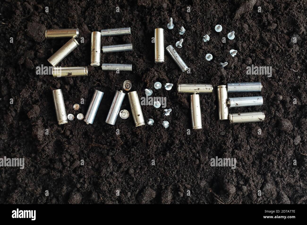 Batteries in the ground. Environmental pollution Stock Photo - Alamy