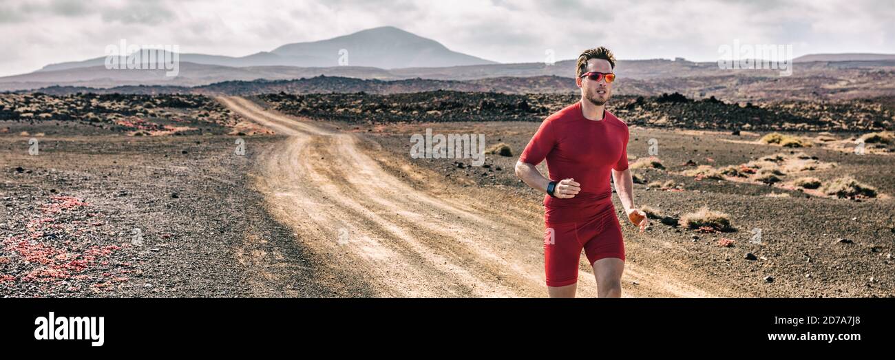 Trail running athlete man runner on mountain path in compression ...