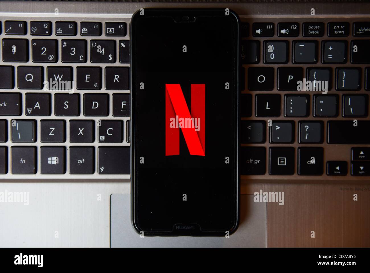 In this photo illustration a Netflix logo seen displayed on a ...