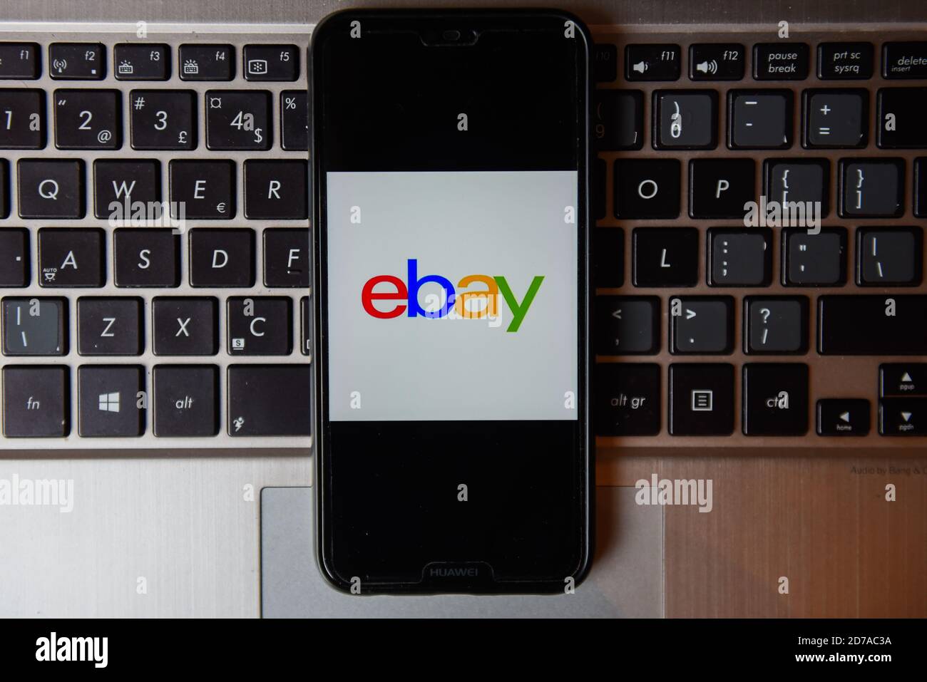 In this photo illustration an Ebay logo seen displayed on a smartphone ...