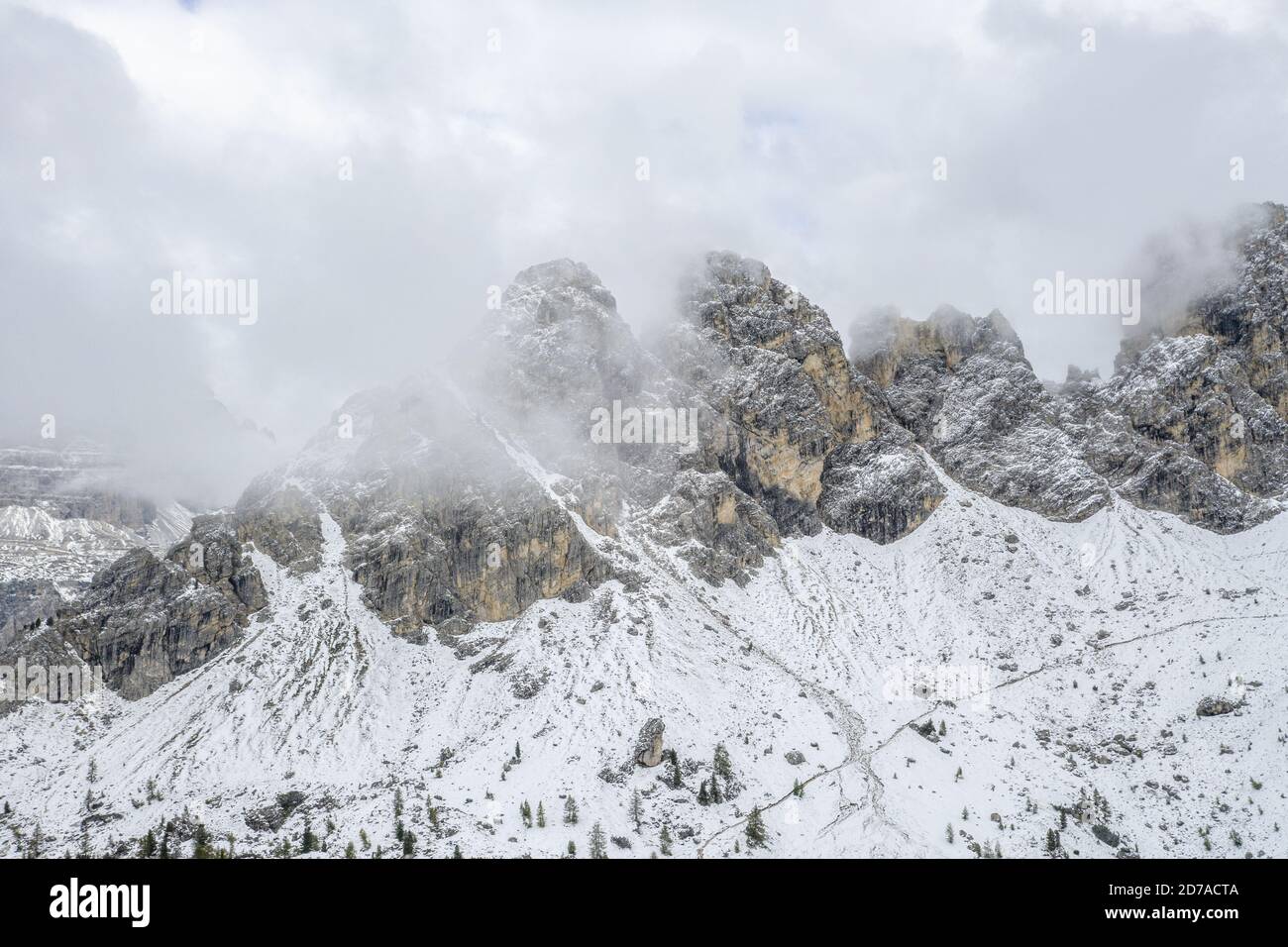 Dolomites covered in the snow and fog at daylight in Italy - great for ...