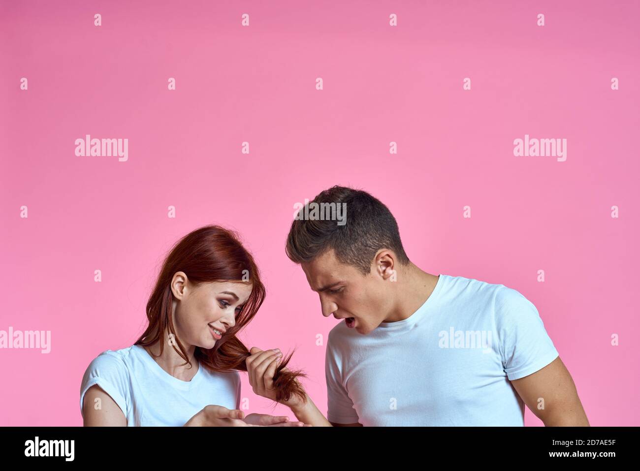 enamored man and woman hugging each other on a pink background cropped ...