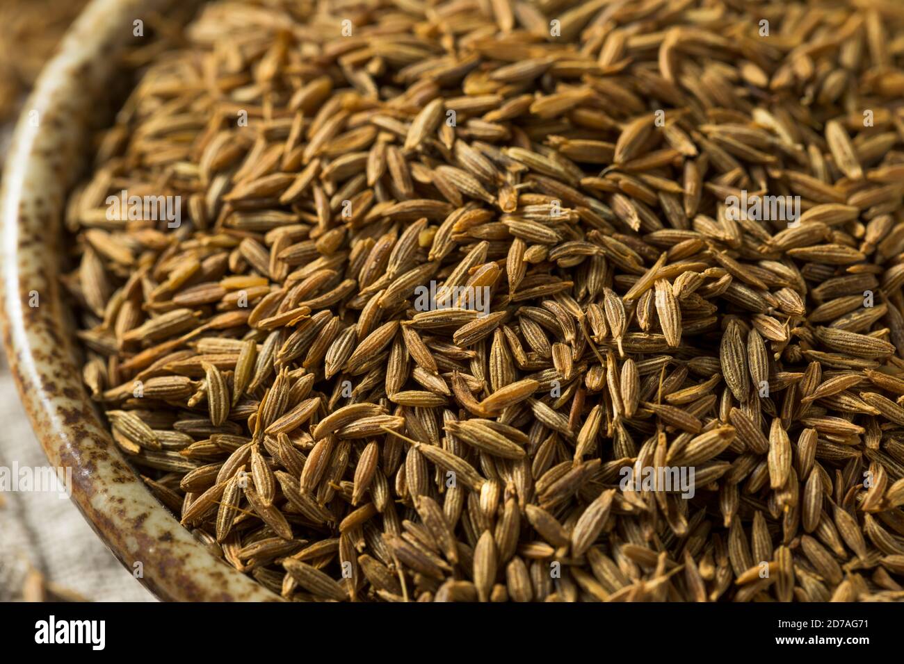 Raw Brown Organic Cumin Seed in a Bowl Stock Photo - Alamy