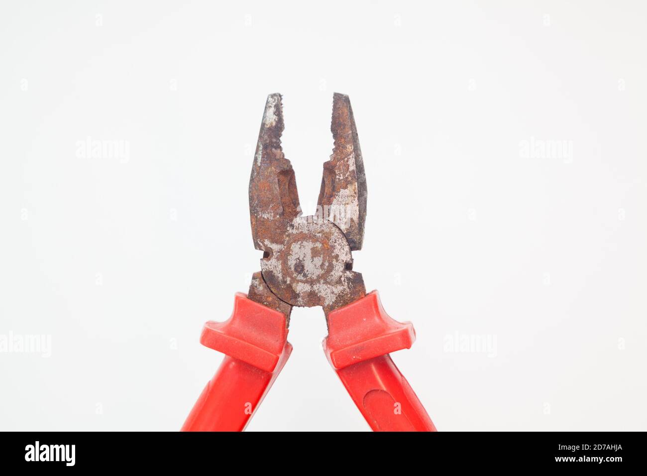 Wide open rusty red pliers against white background Stock Photo - Alamy