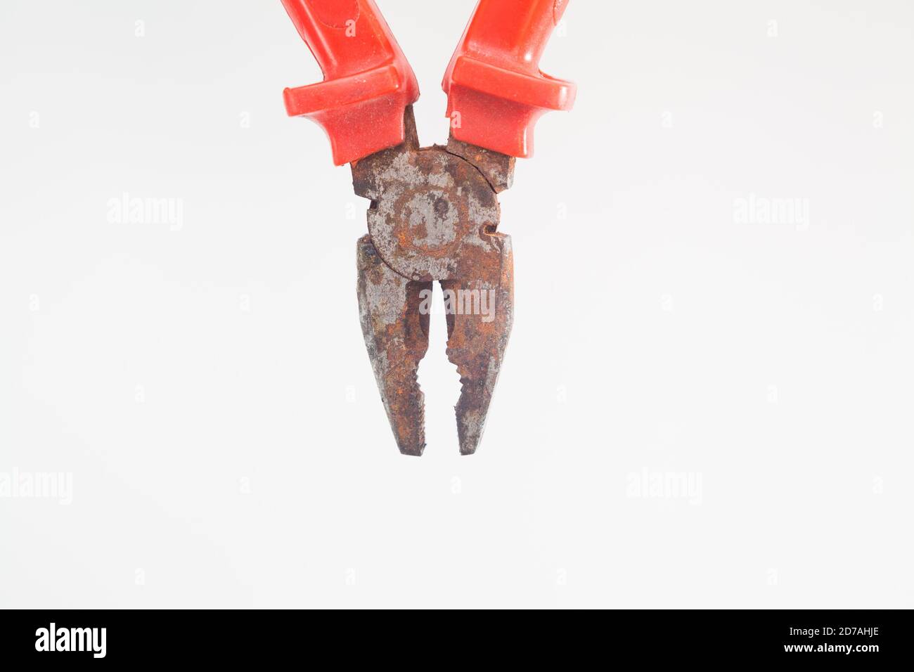 Top view of open rusty red pliers against white background Stock Photo ...