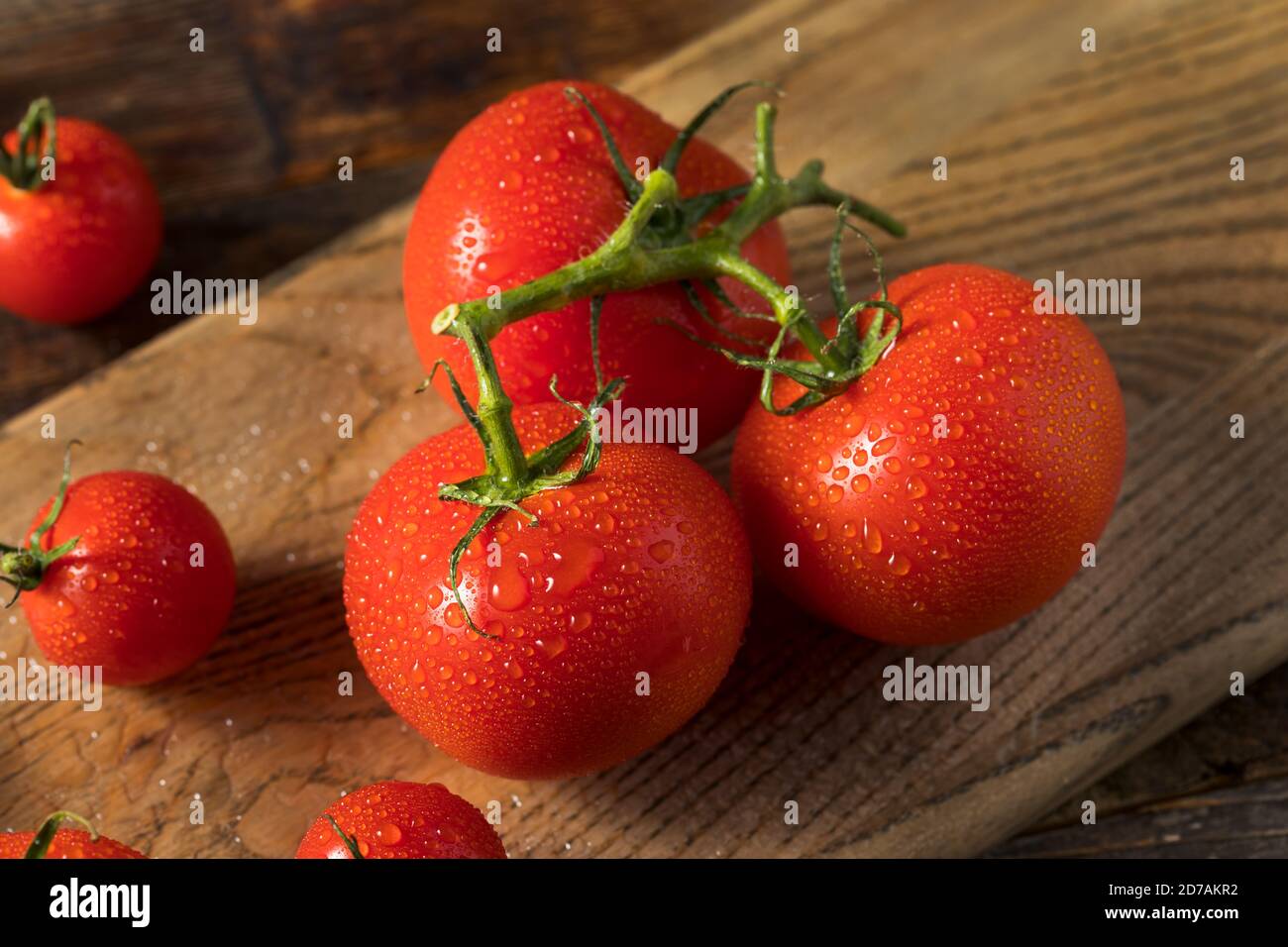 Raw Red Organic Tomatoes in a Bunch Stock Photo - Alamy