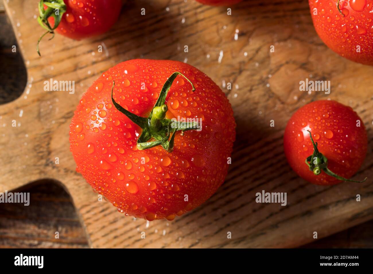Raw Red Organic Tomatoes in a Bunch Stock Photo - Alamy