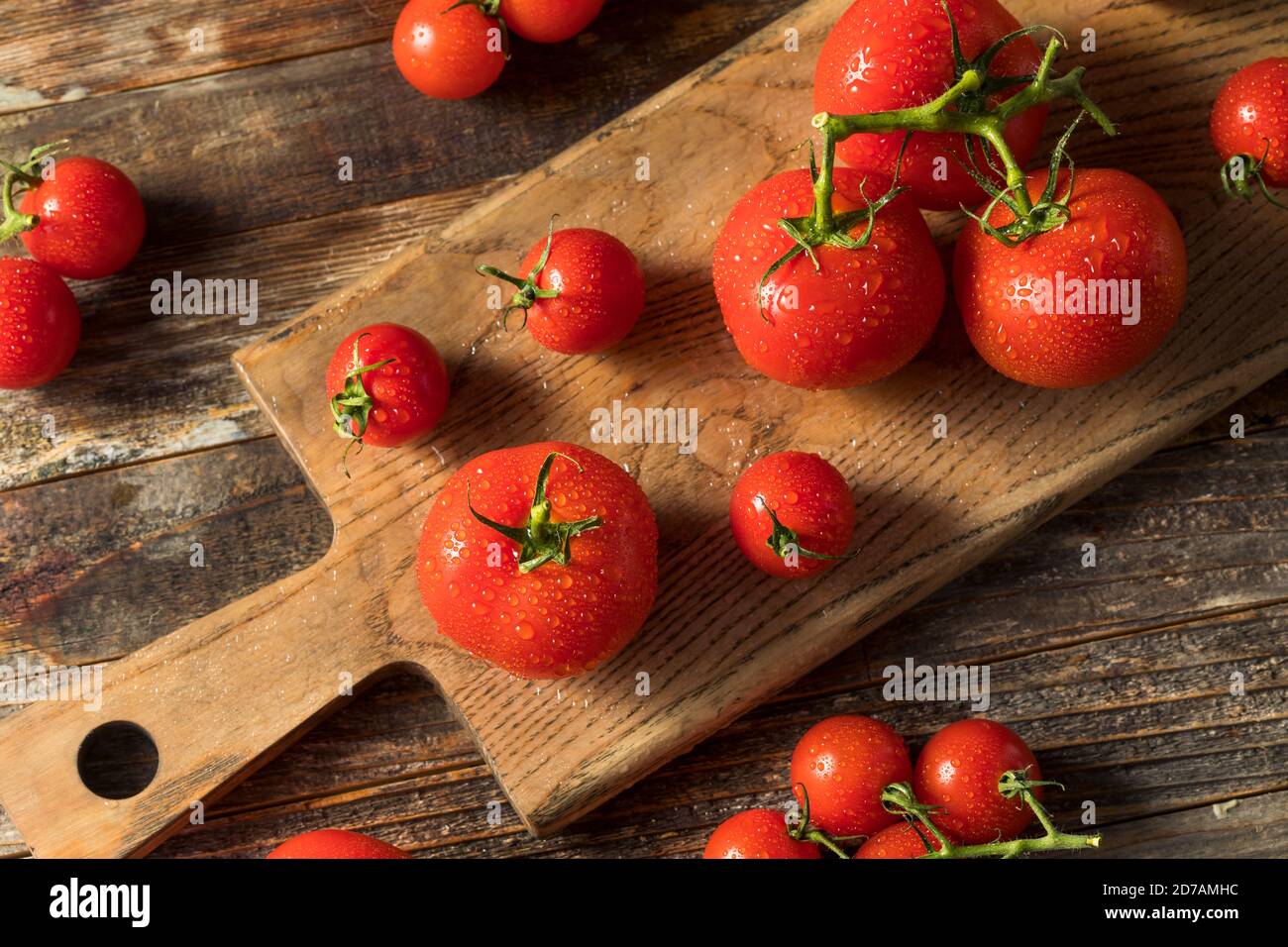 Raw Red Organic Tomatoes in a Bunch Stock Photo - Alamy