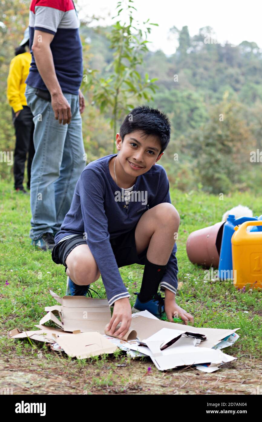 Children picking up garbage in park hi-res stock photography and images ...