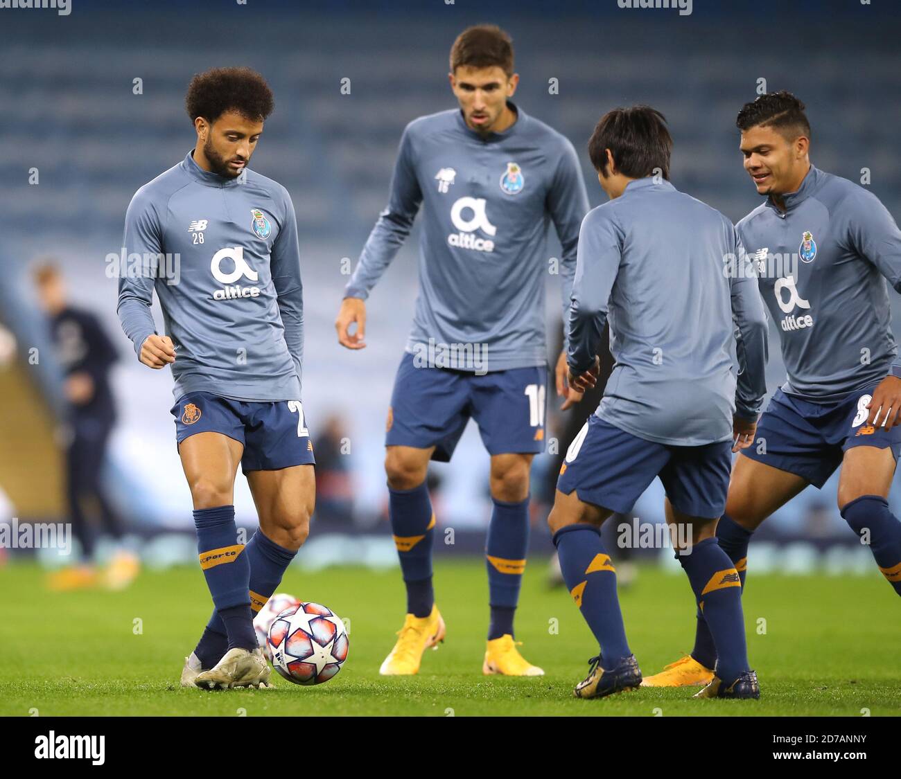 FC Porto's Felipe Anderson (left) and team-mates warm up before the ...