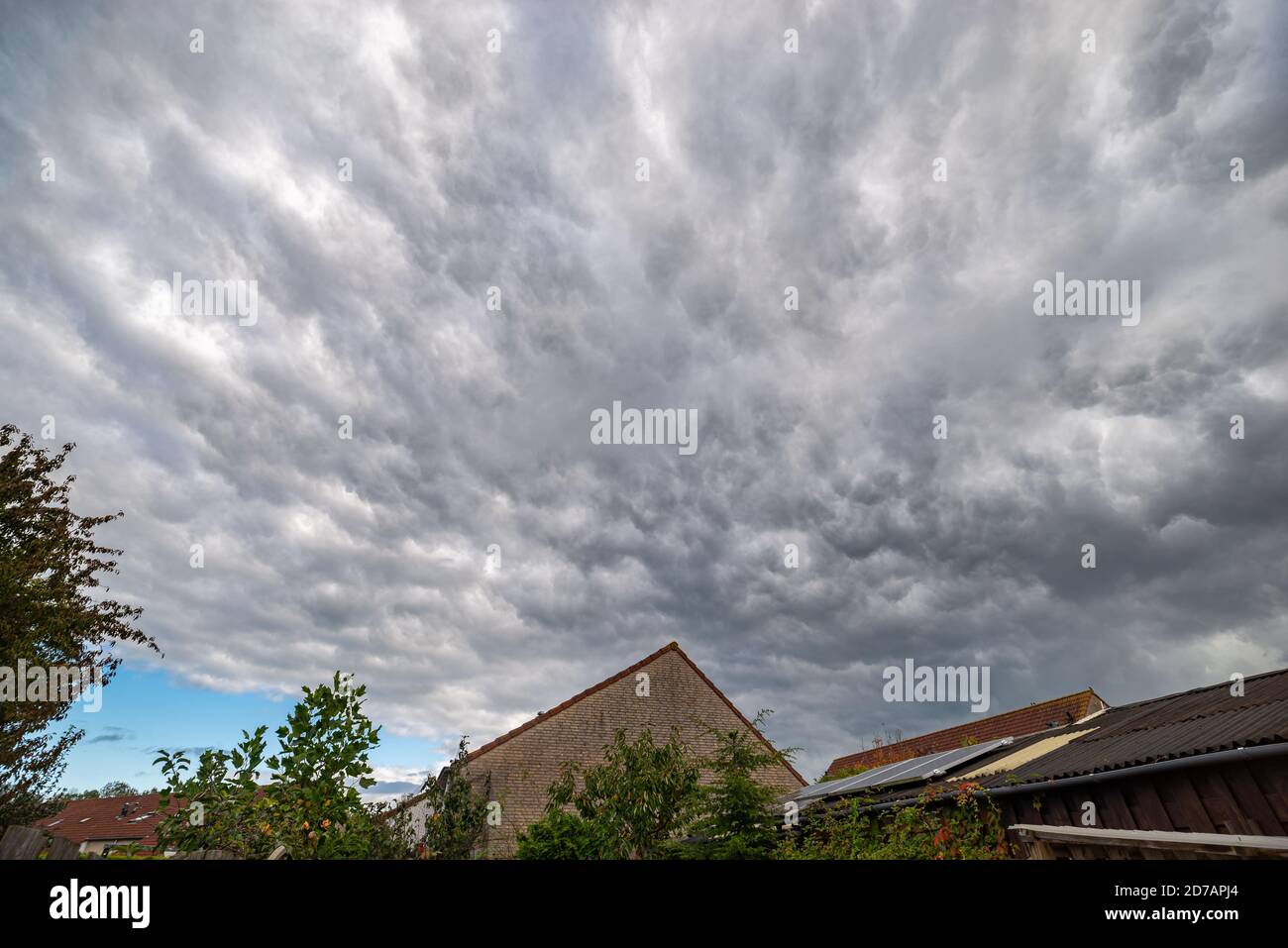 Threatening sky when a thundercloud passes over a city Stock Photo - Alamy
