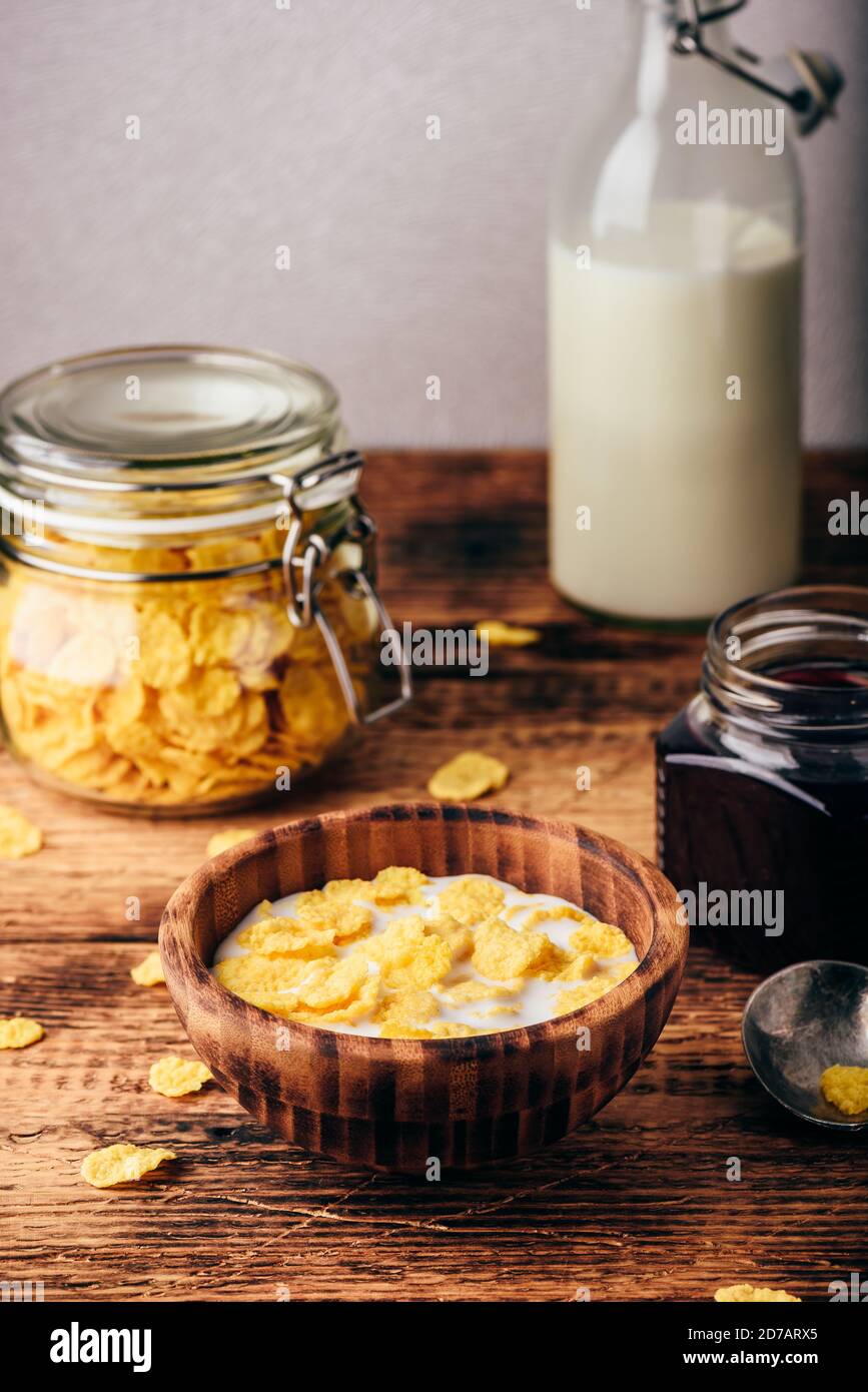 Breakfast with corn flakes, milk and jam Stock Photo - Alamy