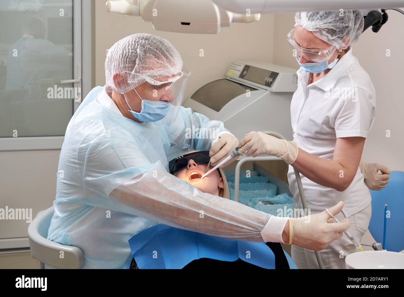 Dentist making local anesthesia shot before surgery Stock Photo - Alamy