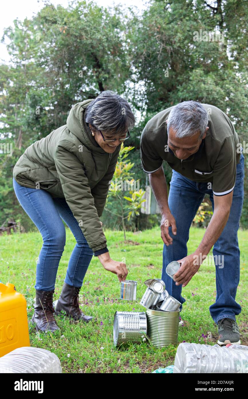 Person recycling cans hi-res stock photography and images - Alamy