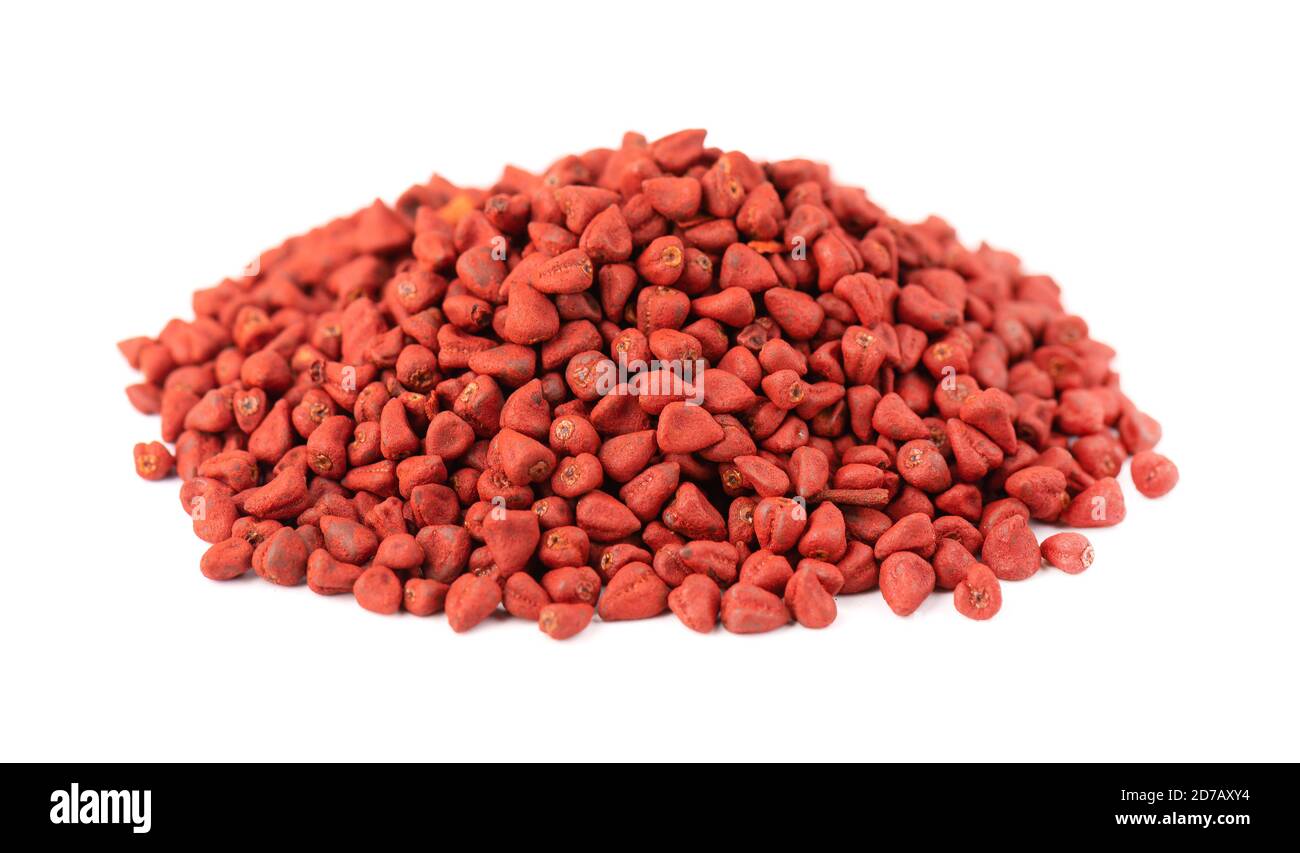 Annatto seeds, isolated on white background. Achiote seeds, bixa ...